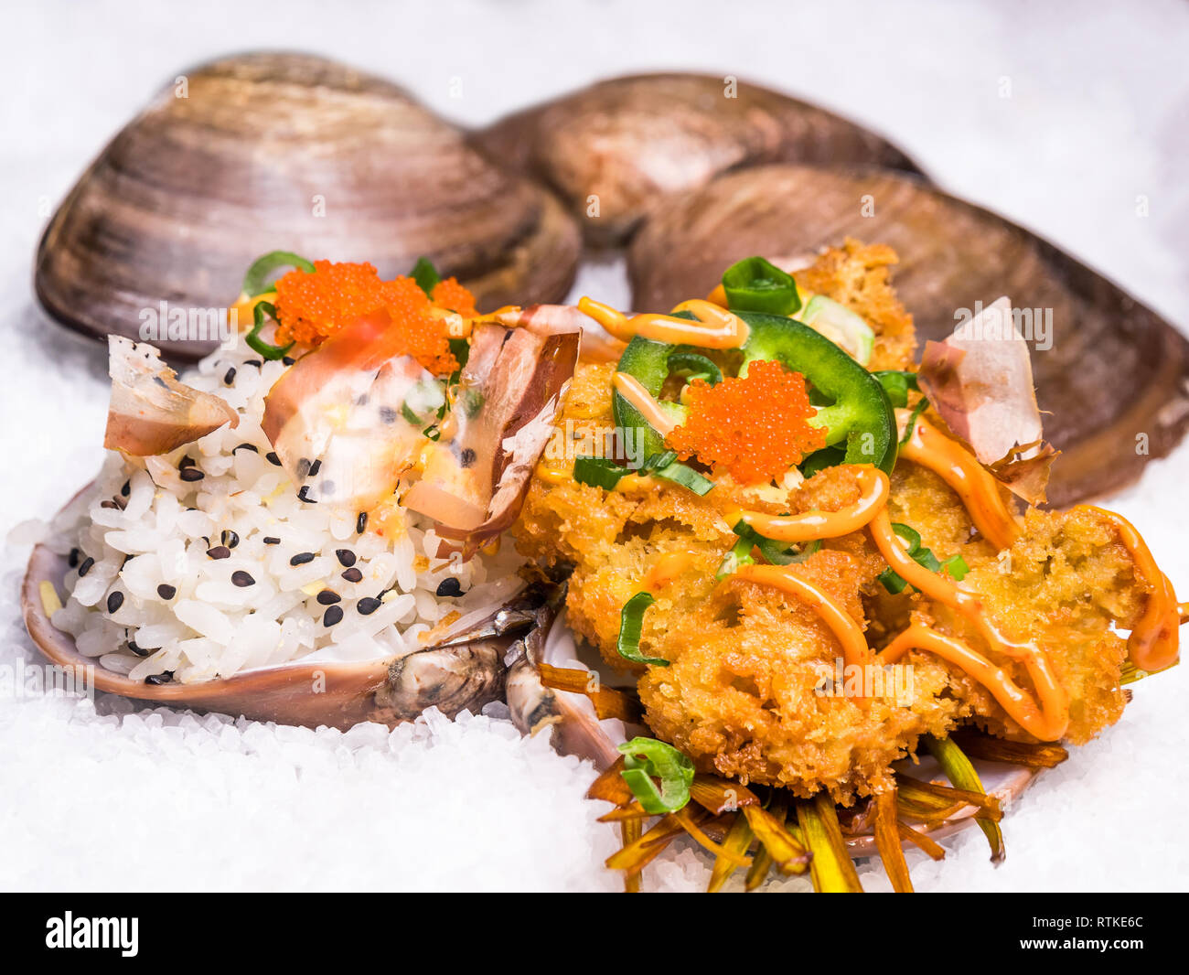 breaded and fried clam with sushi rice and masago Stock Photo - Alamy