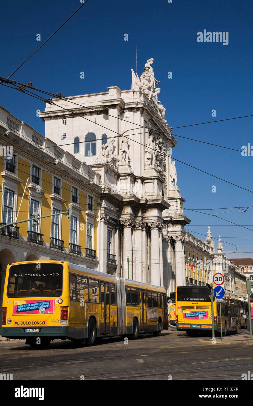 Public transportation buses on a city street and the Augusta Arch in ...