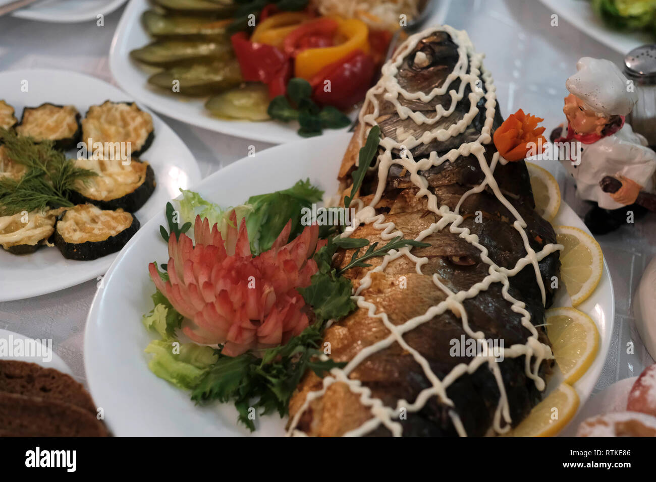 A freshwater bream fish served in traditional Belarusian dinner ...