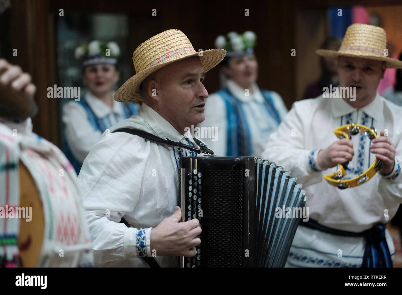 Belarusian folklore band in traditional garment singing folk songs in ...
