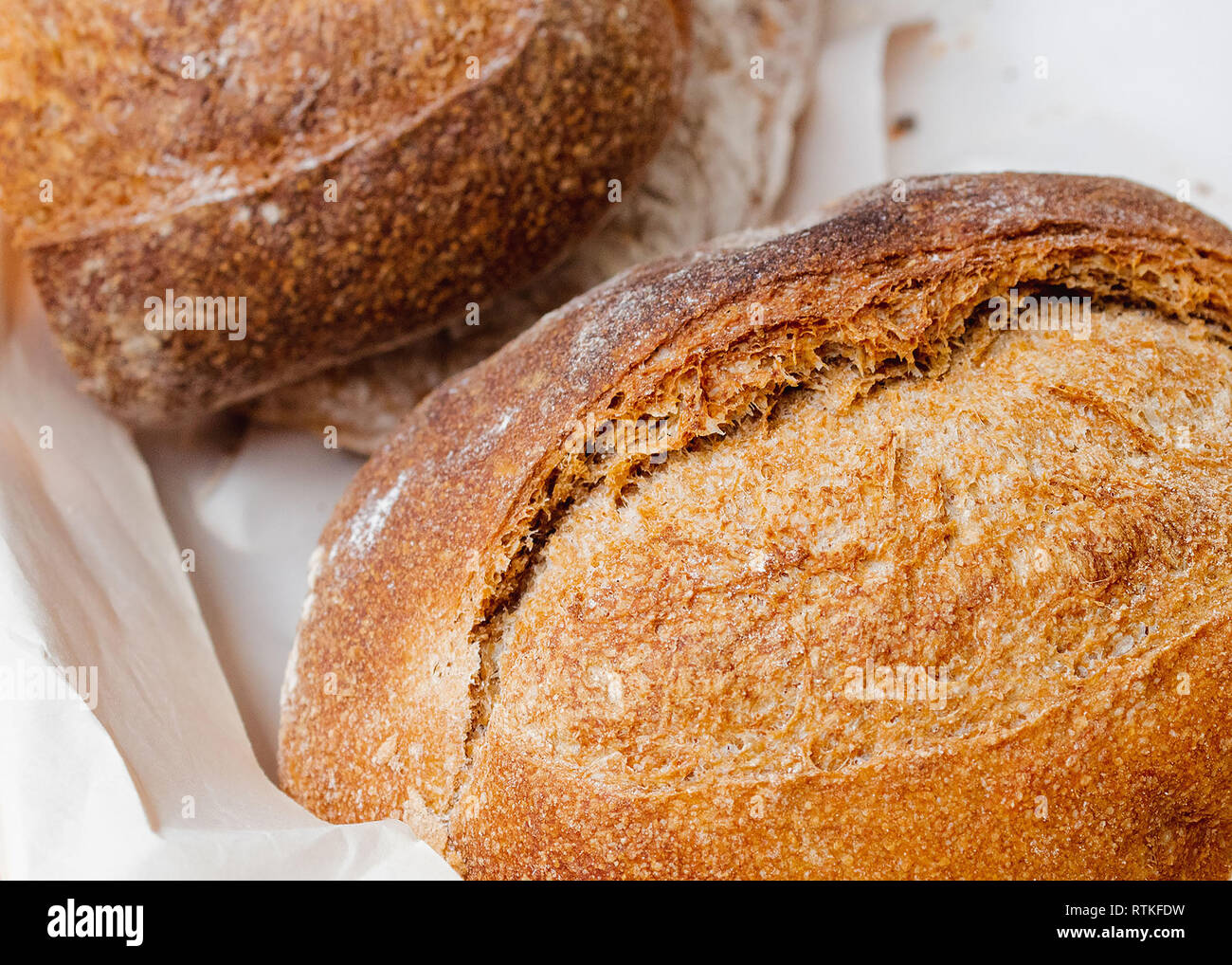 2 large loaves of breads served in a container Stock Photo - Alamy