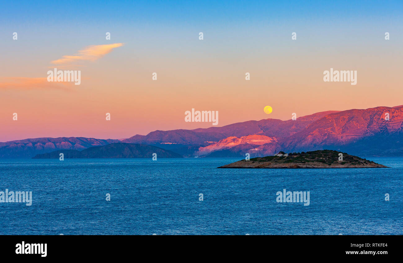 Full moon over the island of Crete at sunset, Mirabello Bay, Crete ...