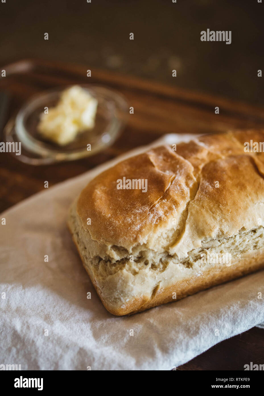 Bread served with butter inside a cafe Stock Photo - Alamy