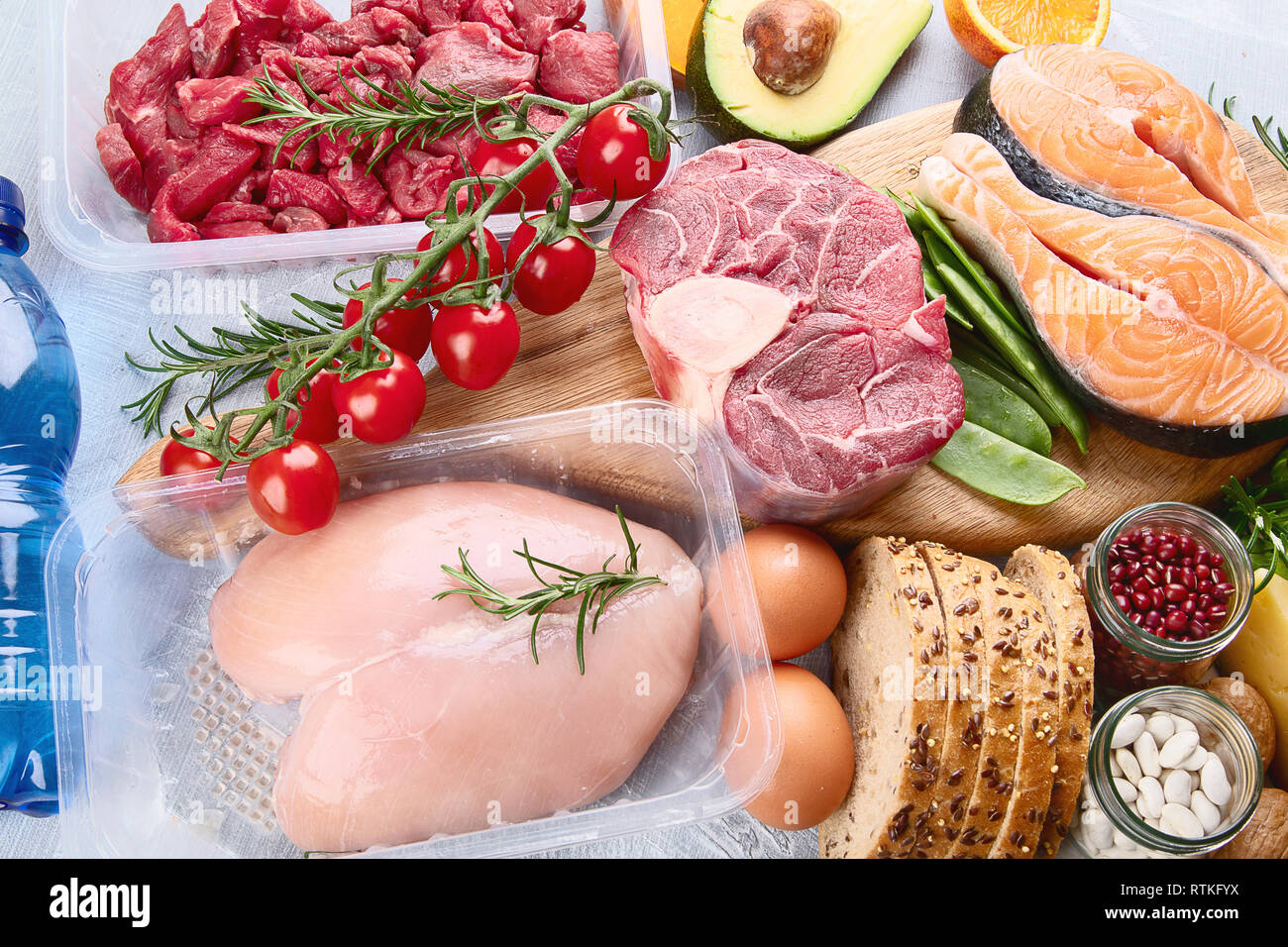 Different health food on a grey background. Top view. Flat lay. Grocery ...
