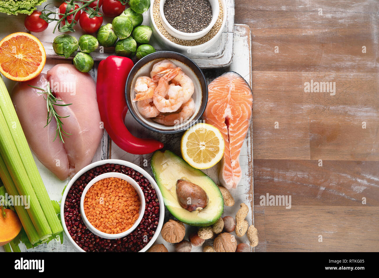 Healthy food: chicken meat, fish, seafood, fresh vegetables, fruits ...