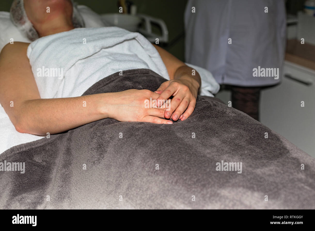 Patient before surgery. Patient on couch in operating department before ...