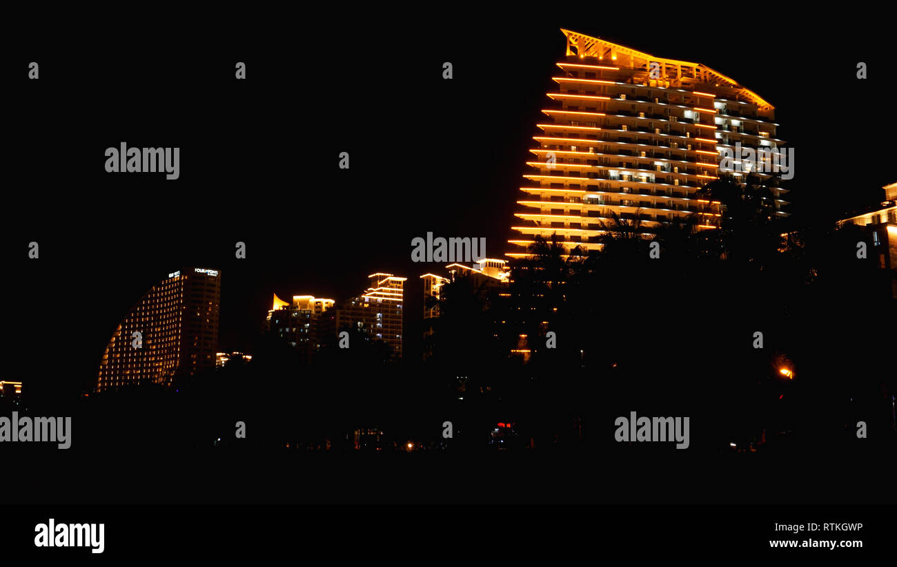 The dark night scene of office building or hotel with lights Stock ...