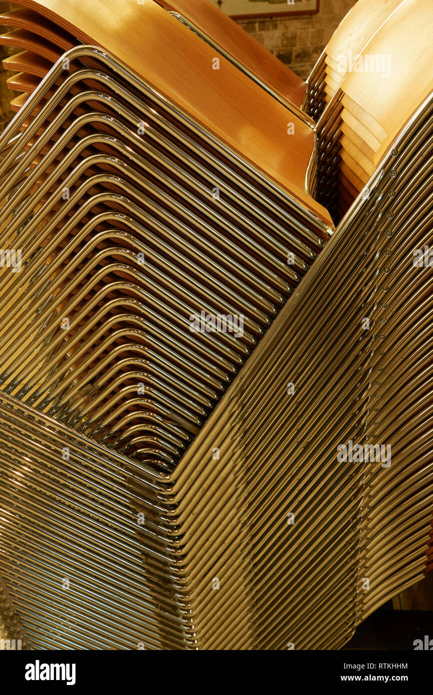 Abstract patterns of stacked metal chairs still-life Stock Photo - Alamy