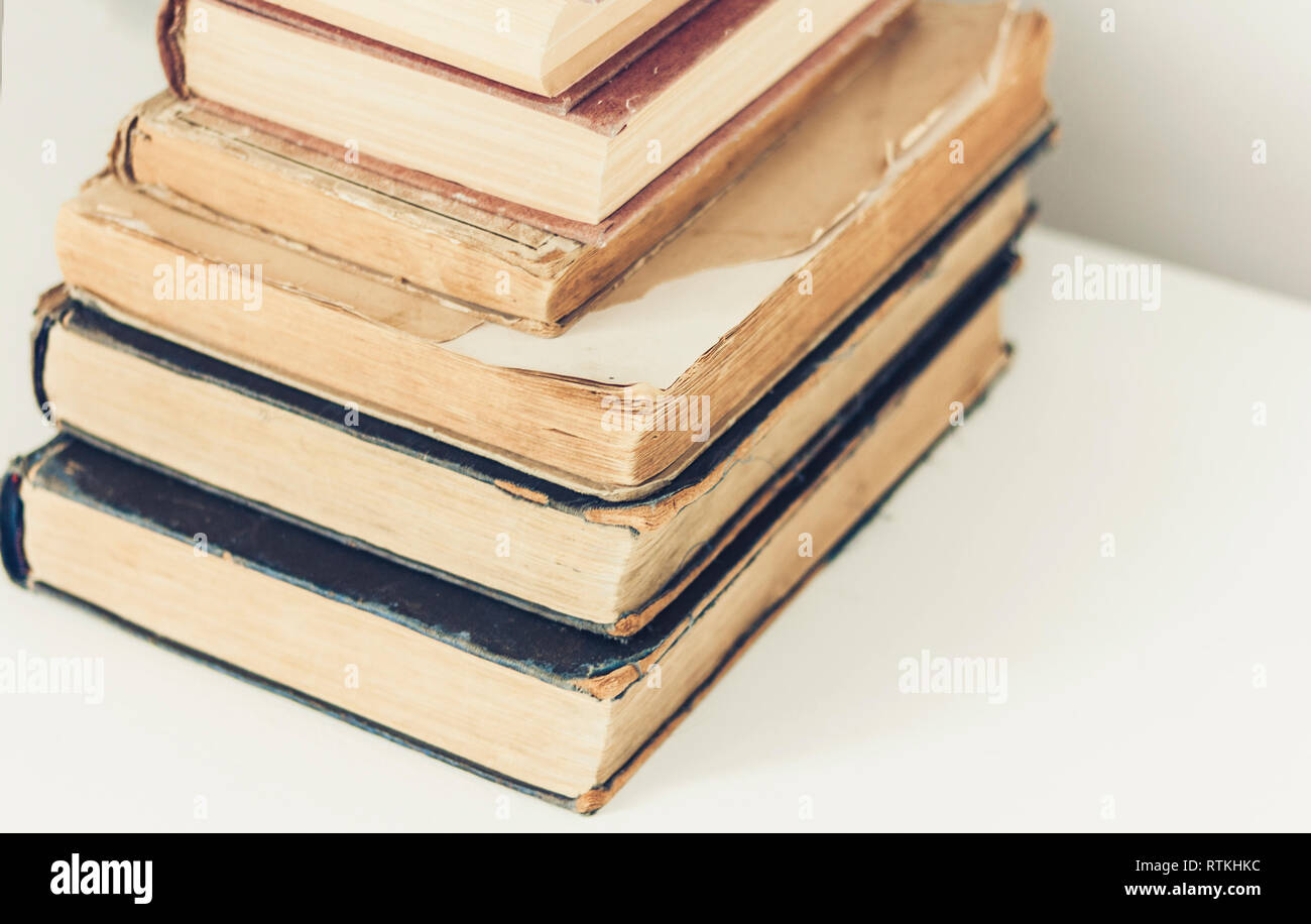 Stack of old books education retro concept background, many books piles ...