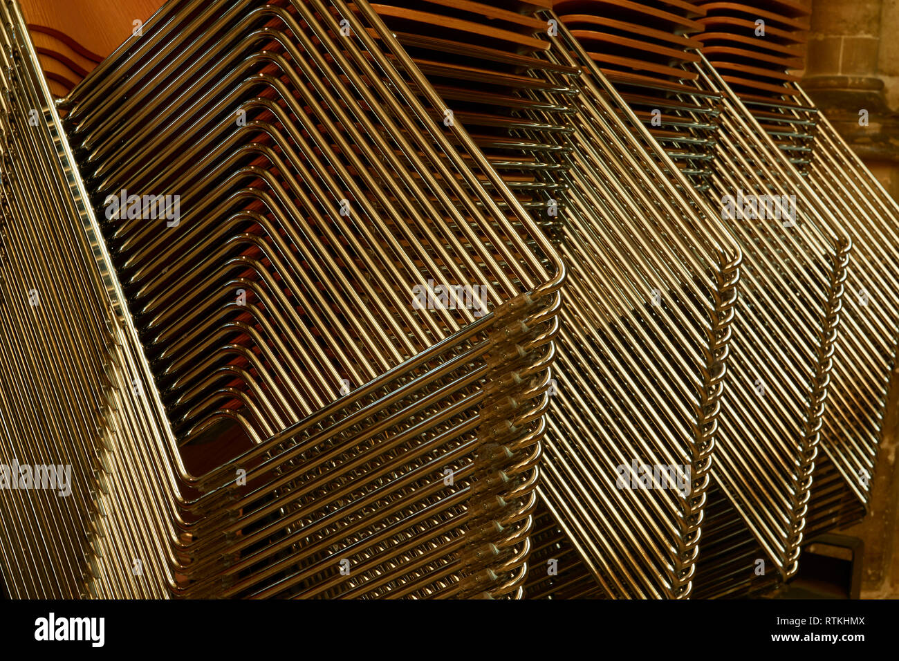 Abstract patterns of stacked metal chairs still-life Stock Photo - Alamy