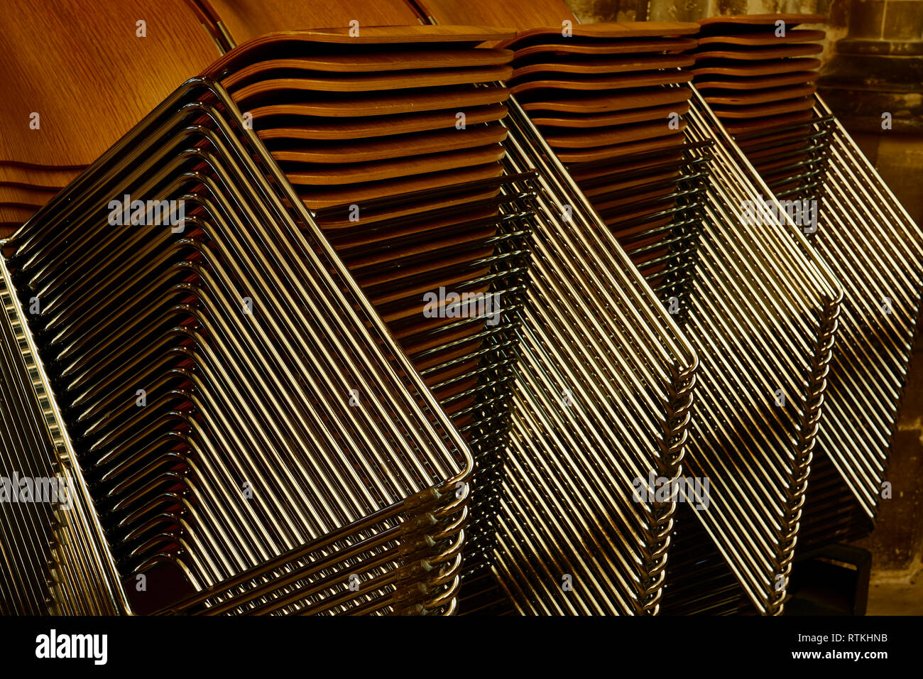 Abstract patterns of stacked metal chairs still-life Stock Photo - Alamy