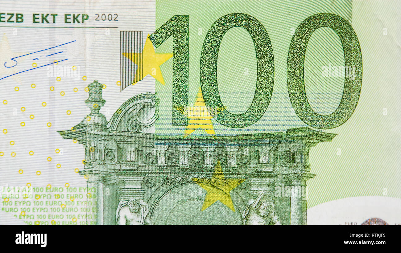 The upper right detail of the 100 Euro bill. Showing the green color ...