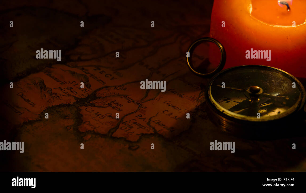 Turnaround view of the compass and the candle. with the compass arrow ...