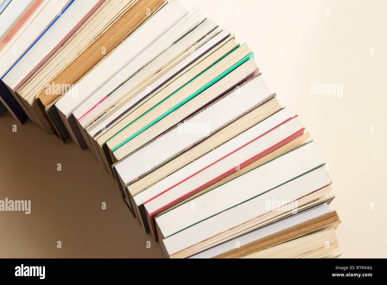 Stack of books with the shadow Stock Photo - Alamy