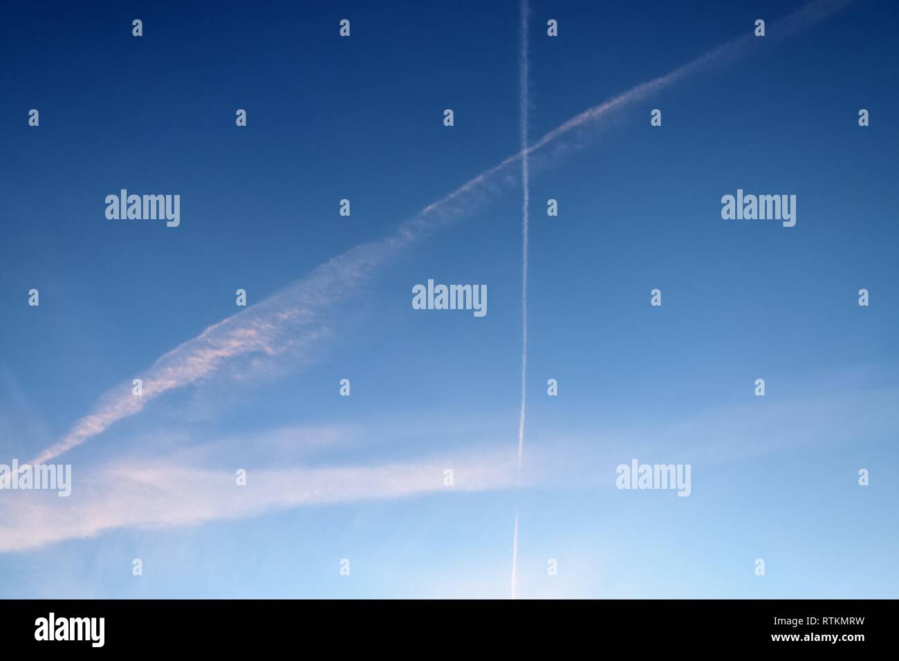 Aircraft contrails in the blue sky taken in northern germany Stock ...