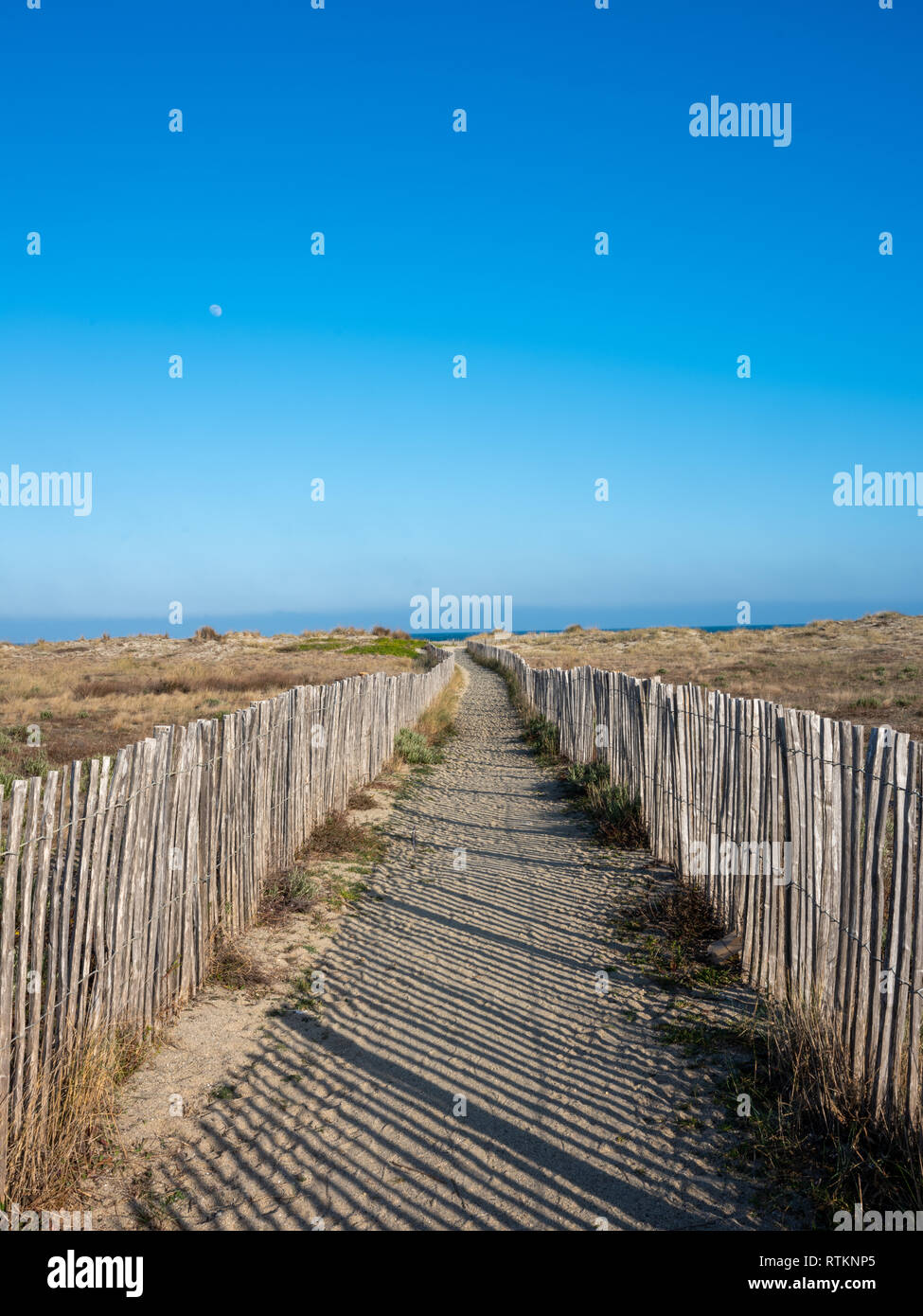 Sandy beach path with wooden railings. Pathway to beach and ocean sea ...