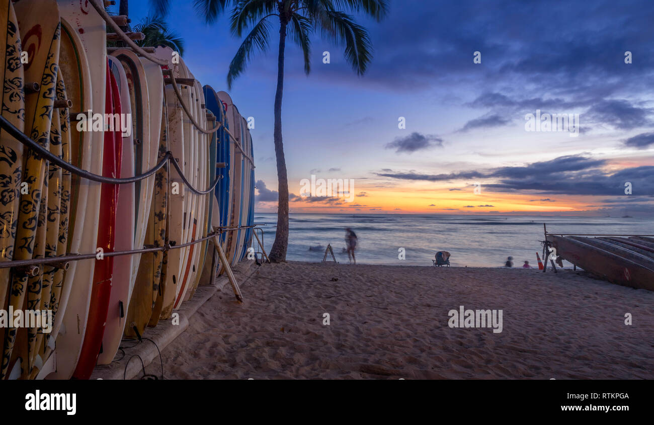Surf rental shop on Waikiki beach at night on August 8, 2016 in ...