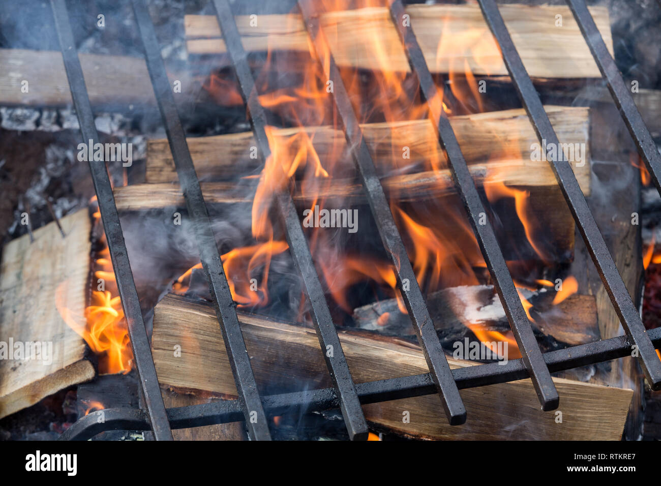 Empty Barbecue Grill With Bright Flames Closeup Stock Photo - Alamy
