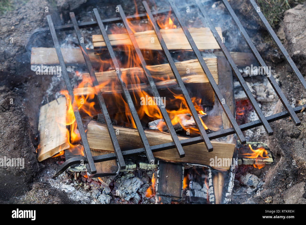 Empty Barbecue Grill With Bright Flames Closeup Stock Photo - Alamy