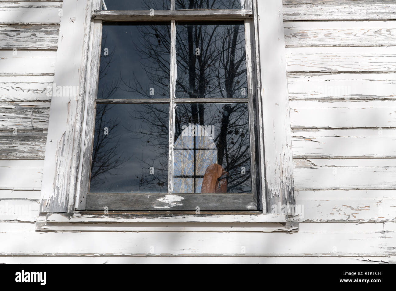 Lower section of a country church window with reflections Stock Photo ...