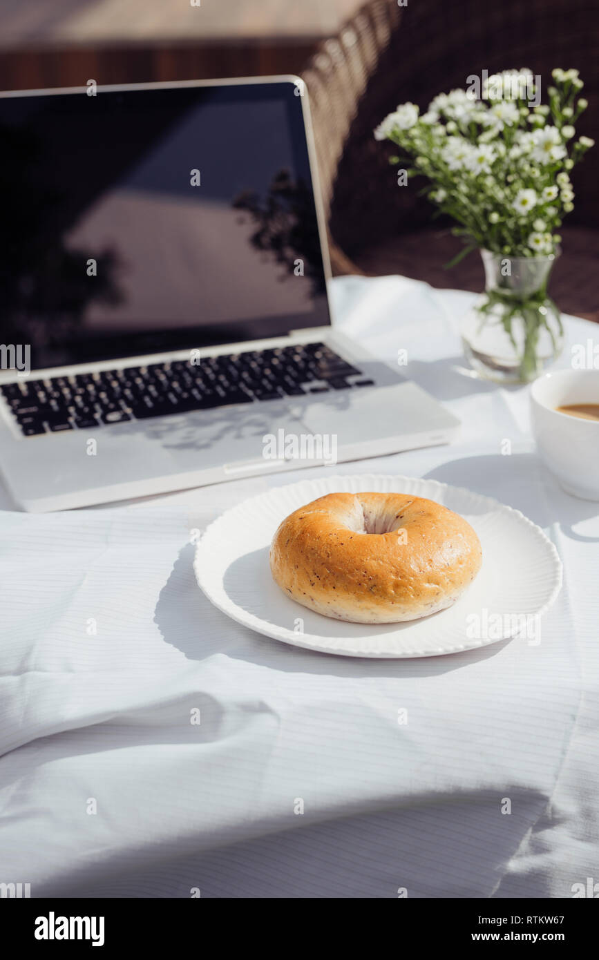 Laptop, bread and cafe in coffee shop Stock Photo - Alamy