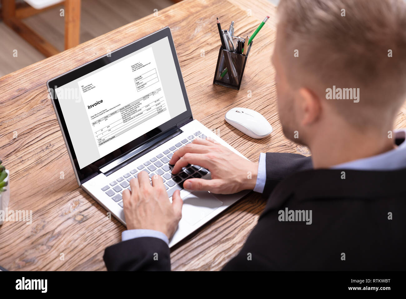 Man invoices laptop hi-res stock photography and images - Alamy