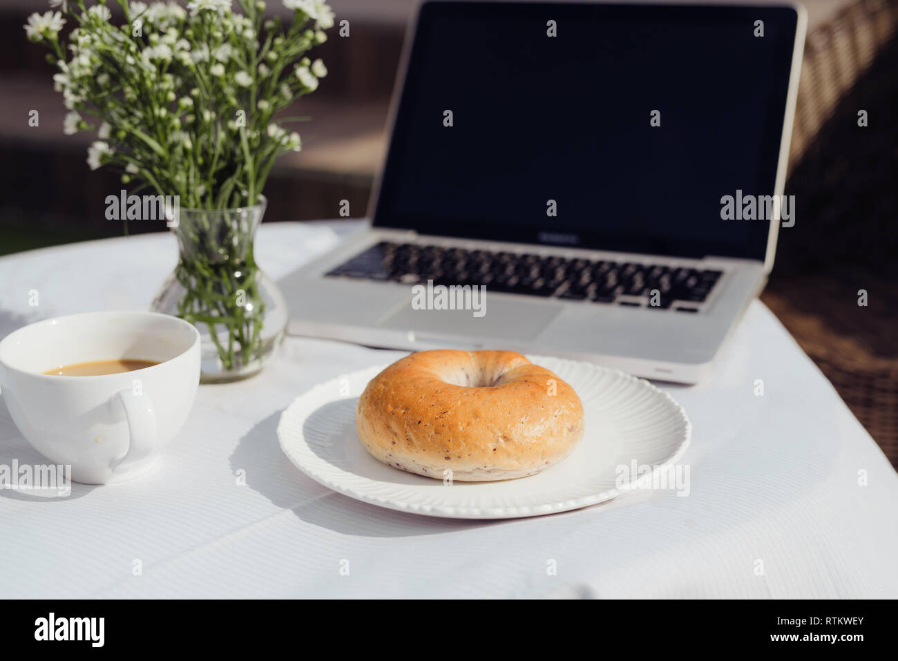 Laptop, bread and cafe in coffee shop Stock Photo - Alamy