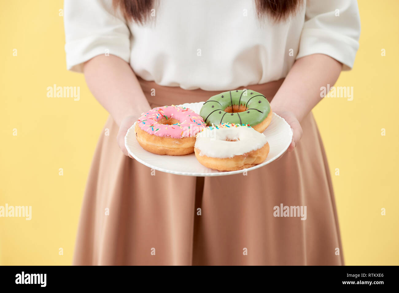 Asian girl show and holding plate full of tasty delicious aromatic ...