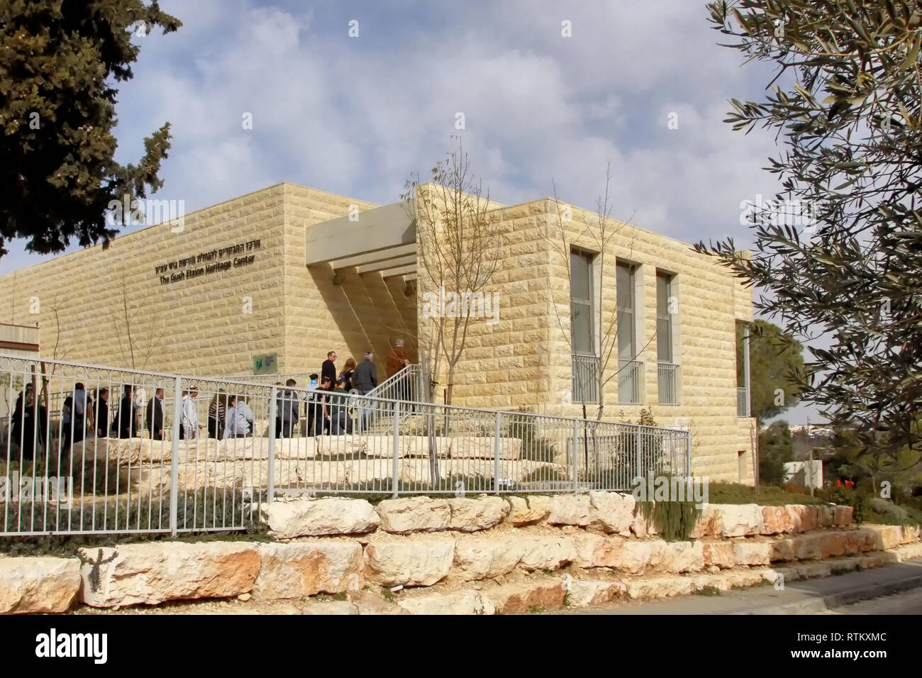 A group of people enter the Gush Etzion Heritage Center in Kfar Etzion ...