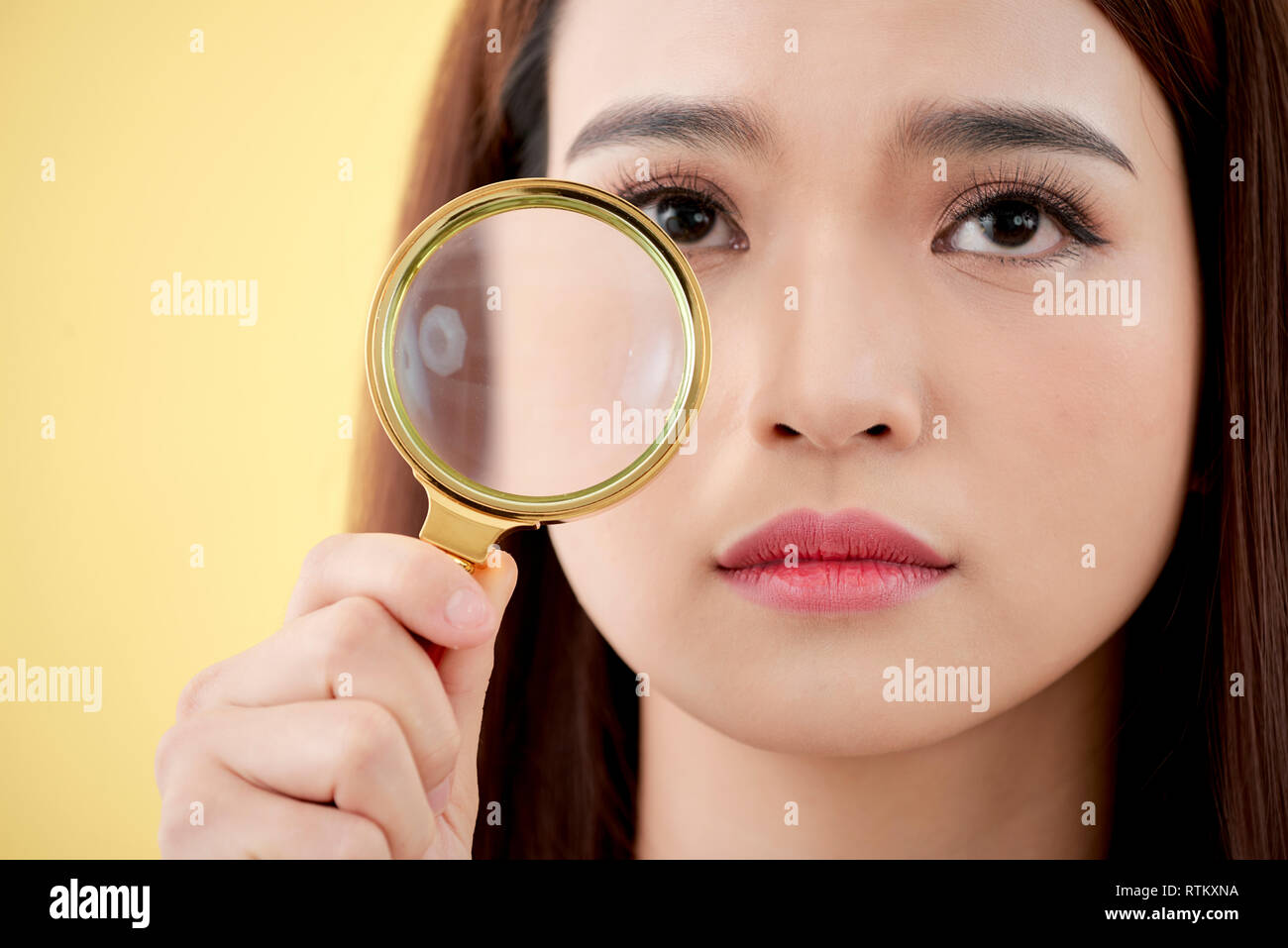 Woman with magnifying glass hi-res stock photography and images - Alamy