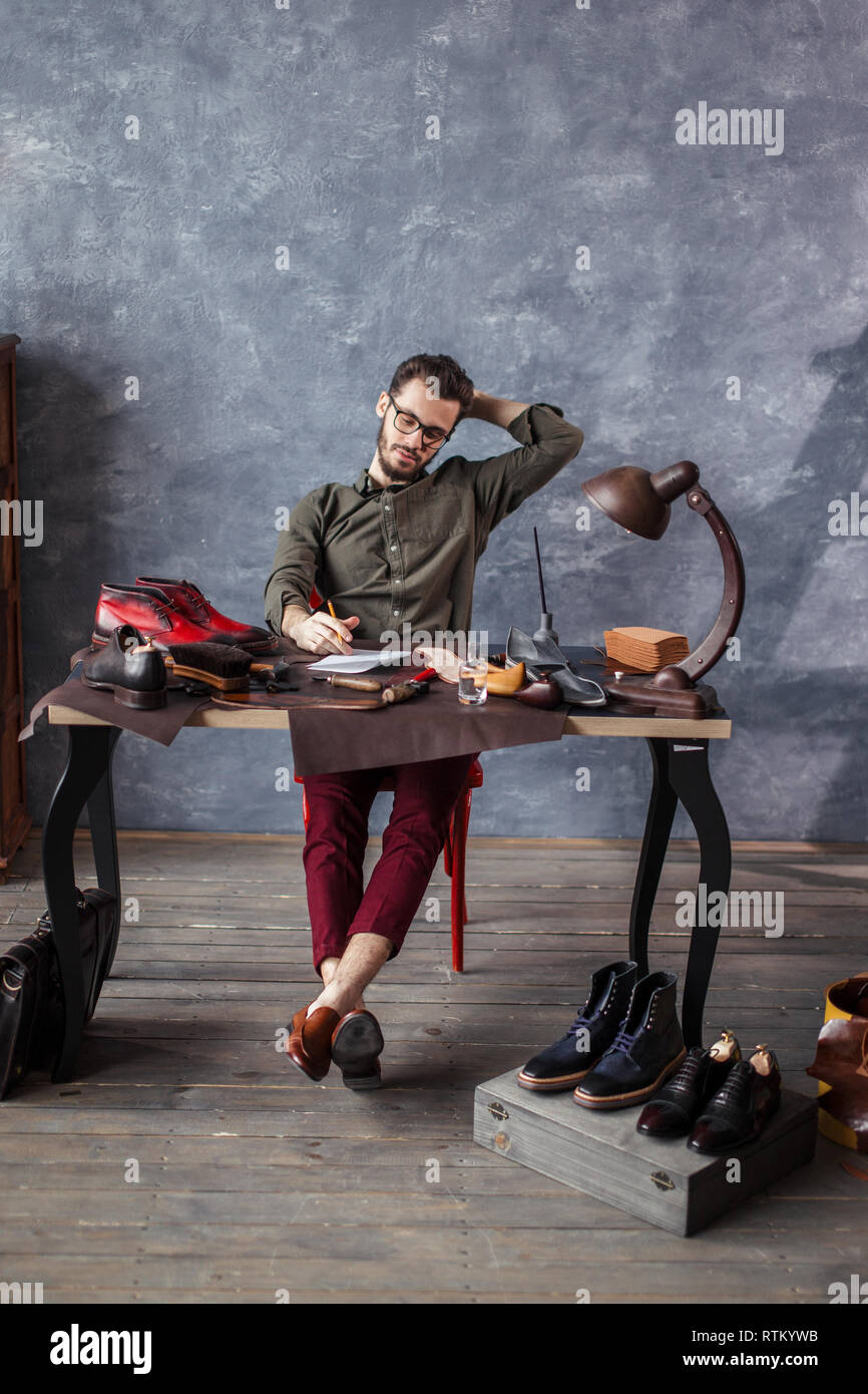 young creative man executing his design, full length photo, shoe ...