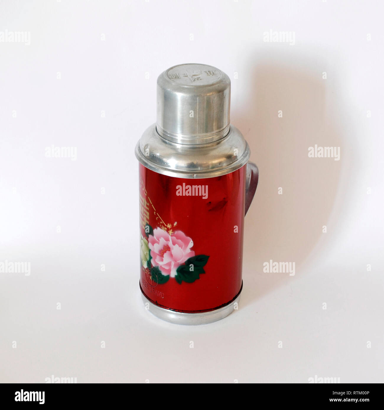 vintage chinese aluminum thermos with flowers Stock Photo - Alamy