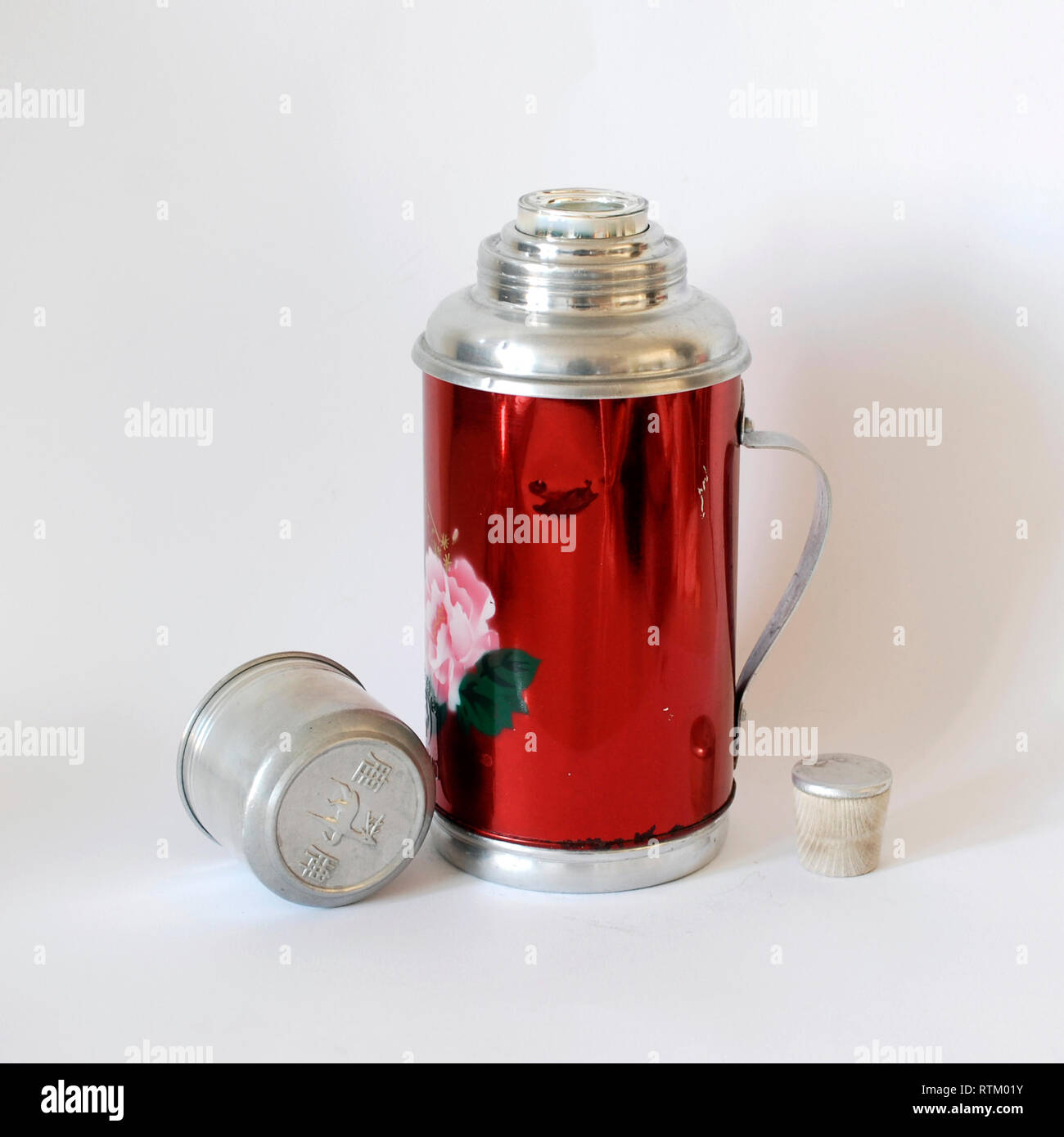 vintage chinese aluminum thermos with flowers Stock Photo - Alamy