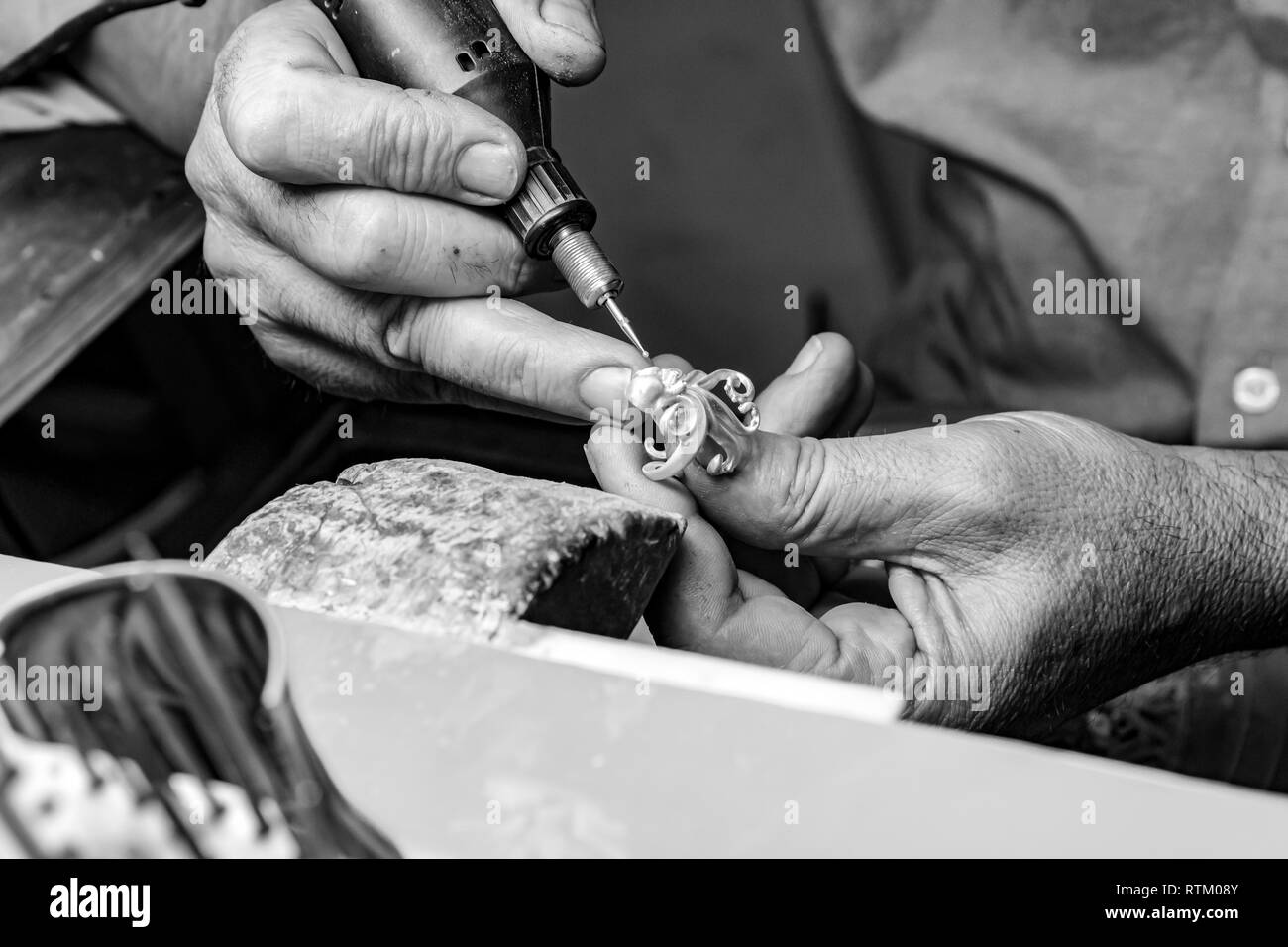 male hands of jewelry technician while working Stock Photo - Alamy