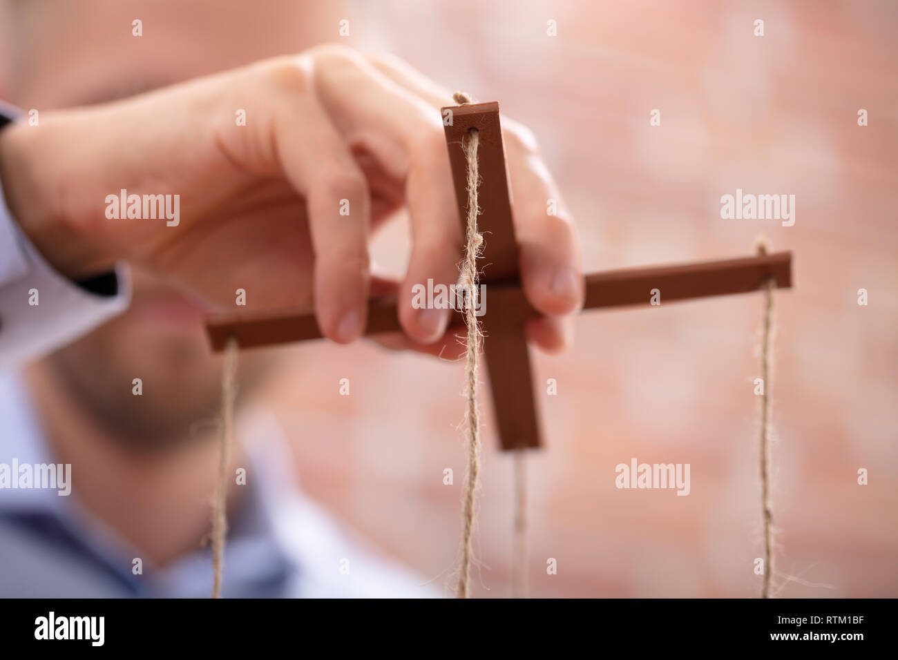 Person manipulated marionette hi-res stock photography and images - Alamy