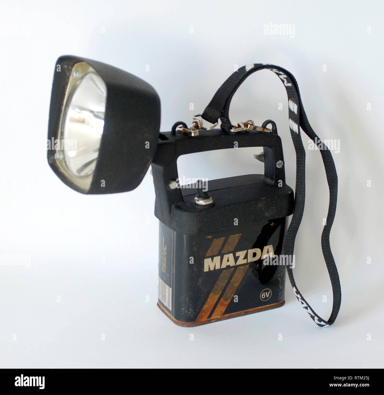 Old battery powered flashlight Mazda brand Stock Photo - Alamy