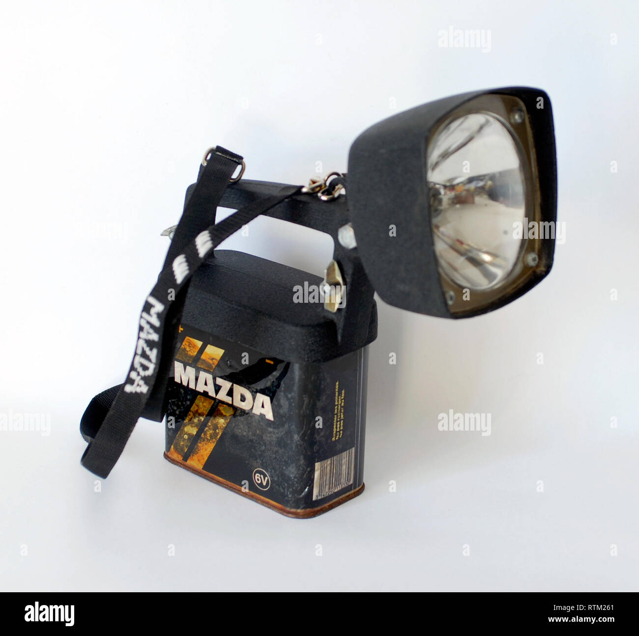 Old battery powered flashlight Mazda brand Stock Photo - Alamy