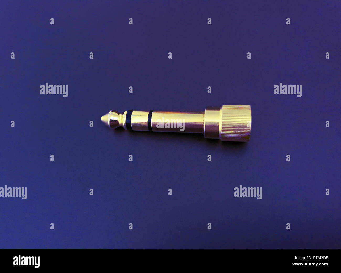 Audio plug jack connector for music on blue background Stock Photo - Alamy