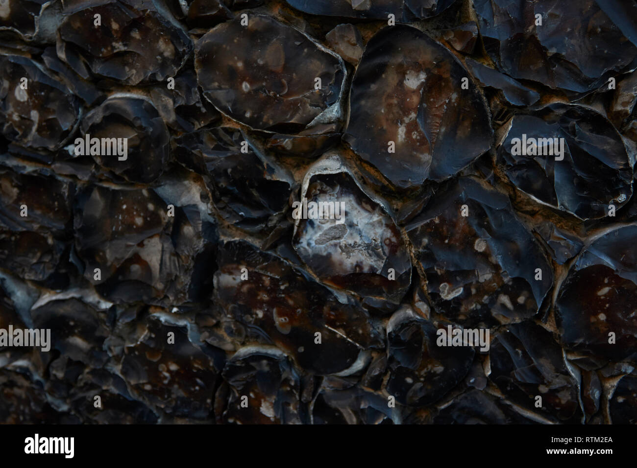 Attractive black flint wall architecture Stock Photo - Alamy