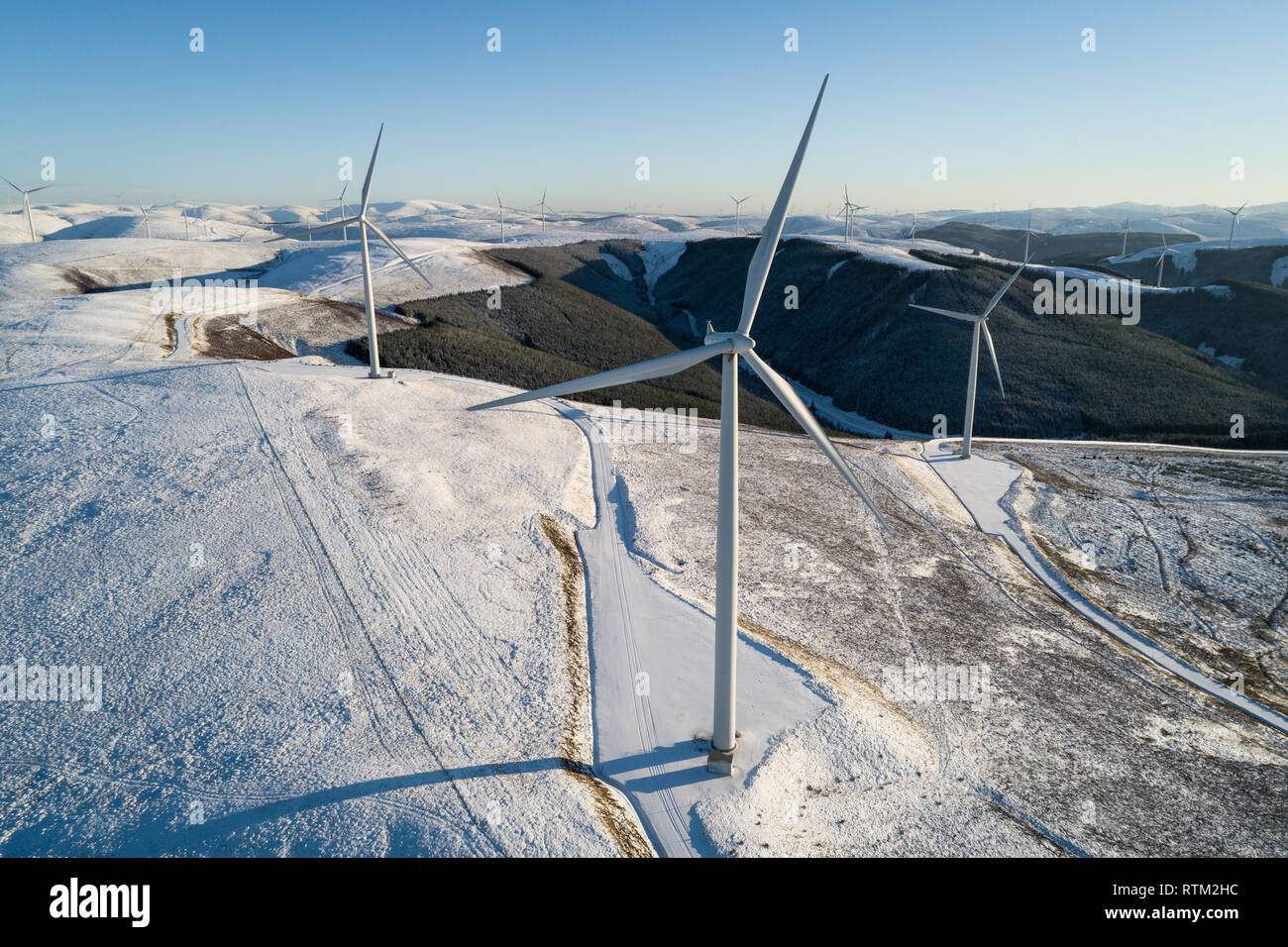 Aerial image of the Clyde Wind Farm Extension in snow on a bright ...