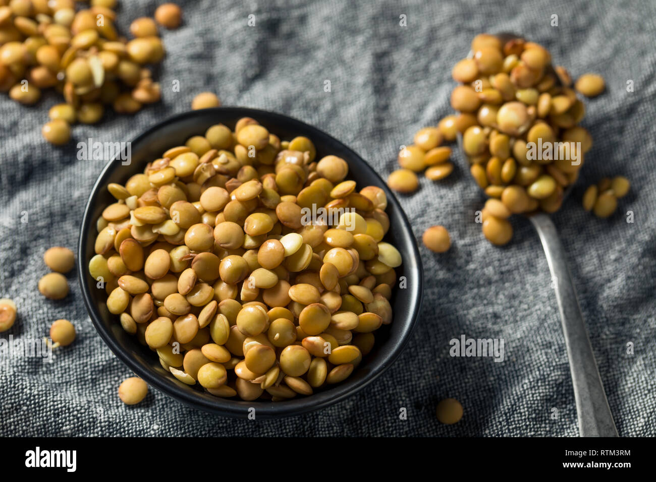 Raw lentil in bowl hi-res stock photography and images - Alamy