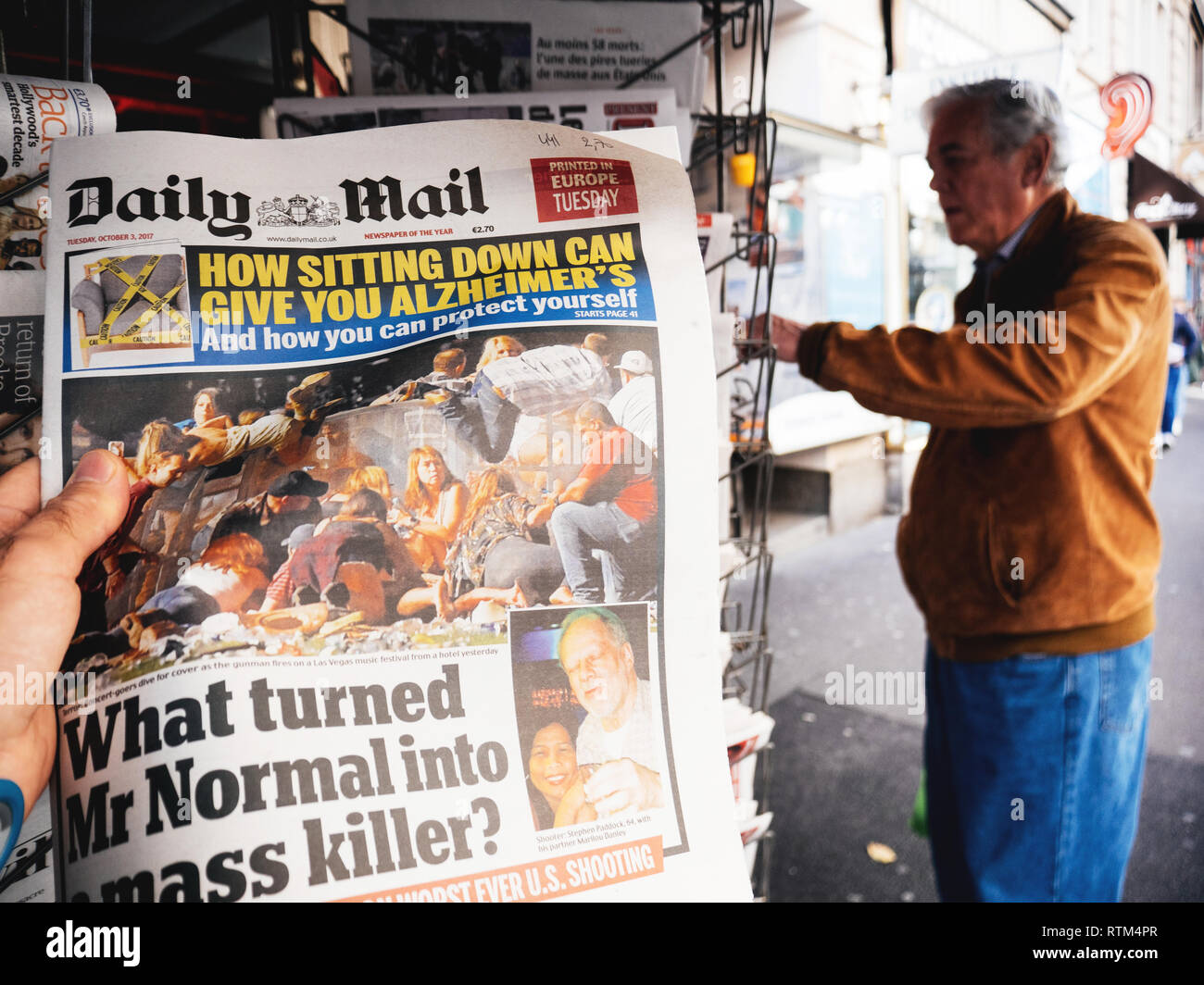 PARIS, FRANCE - OCT 3, 2017: Man buying Daily Dail newspaper with ...