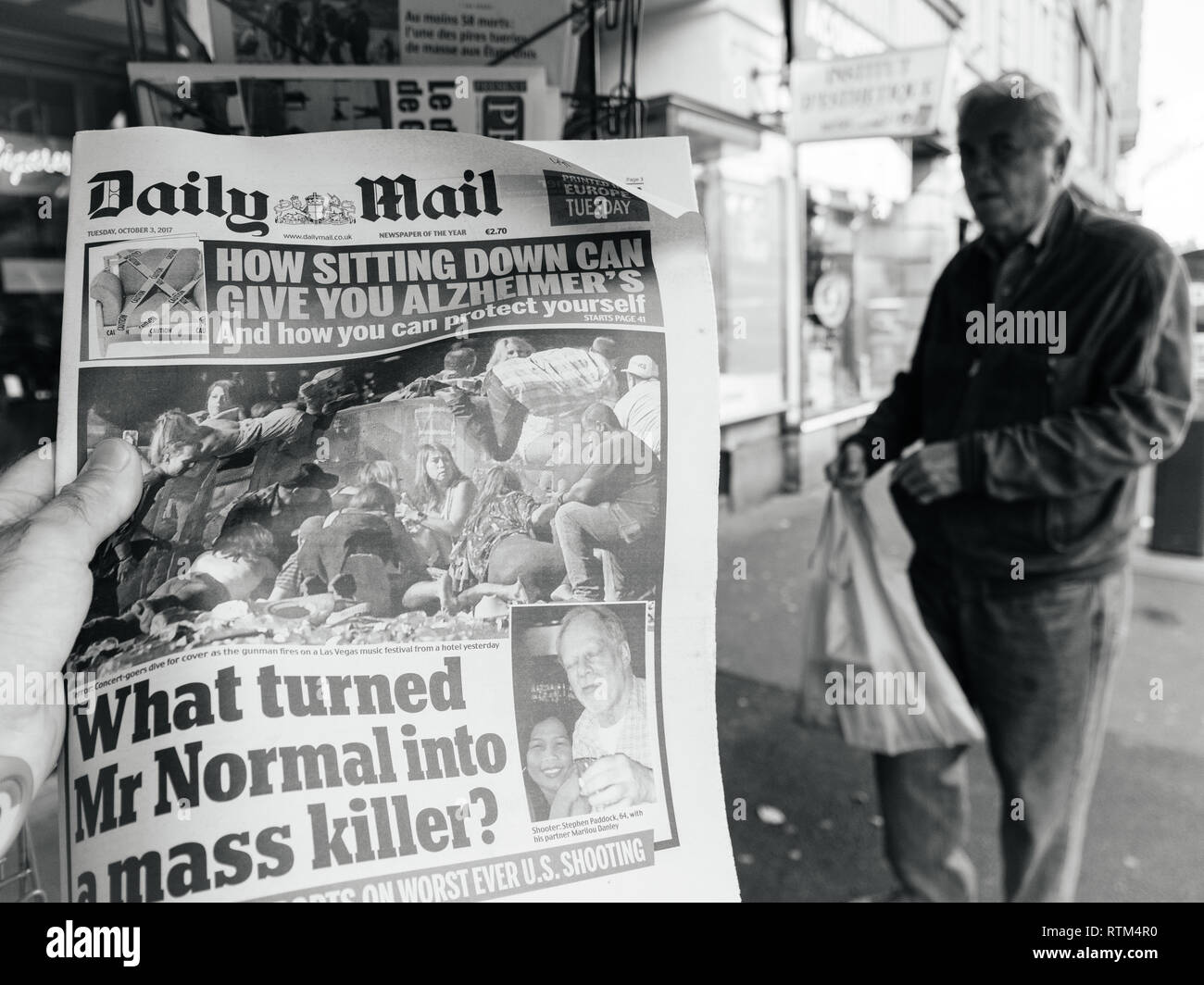 PARIS, FRANCE - OCT 3, 2017: Man buying Daily Dail newspaper with ...