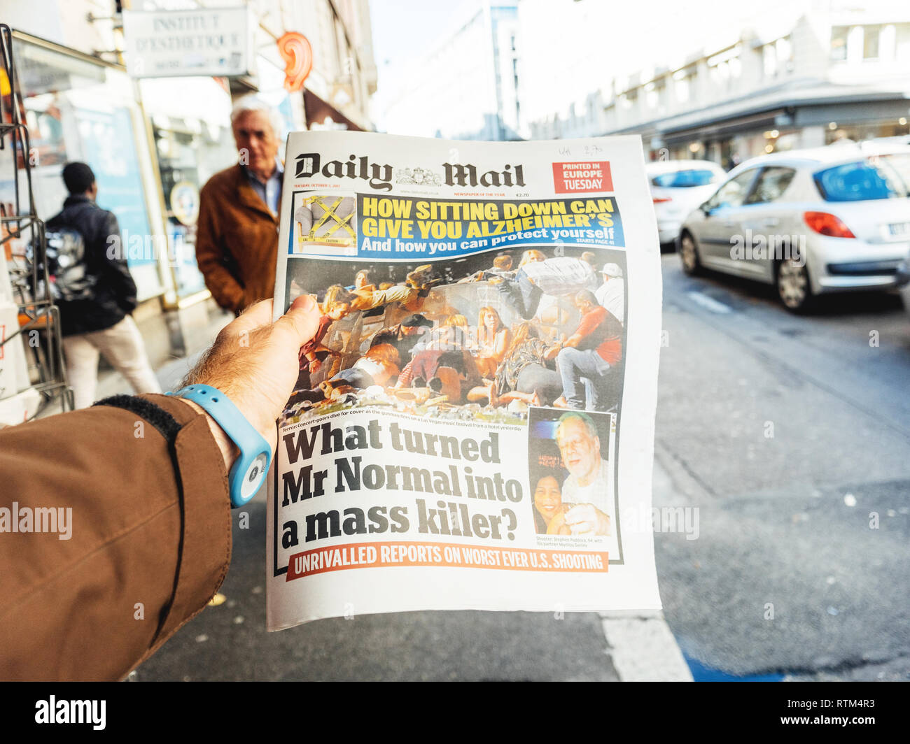 PARIS, FRANCE - OCT 3, 2017: Man buying Daily Dail newspaper with ...