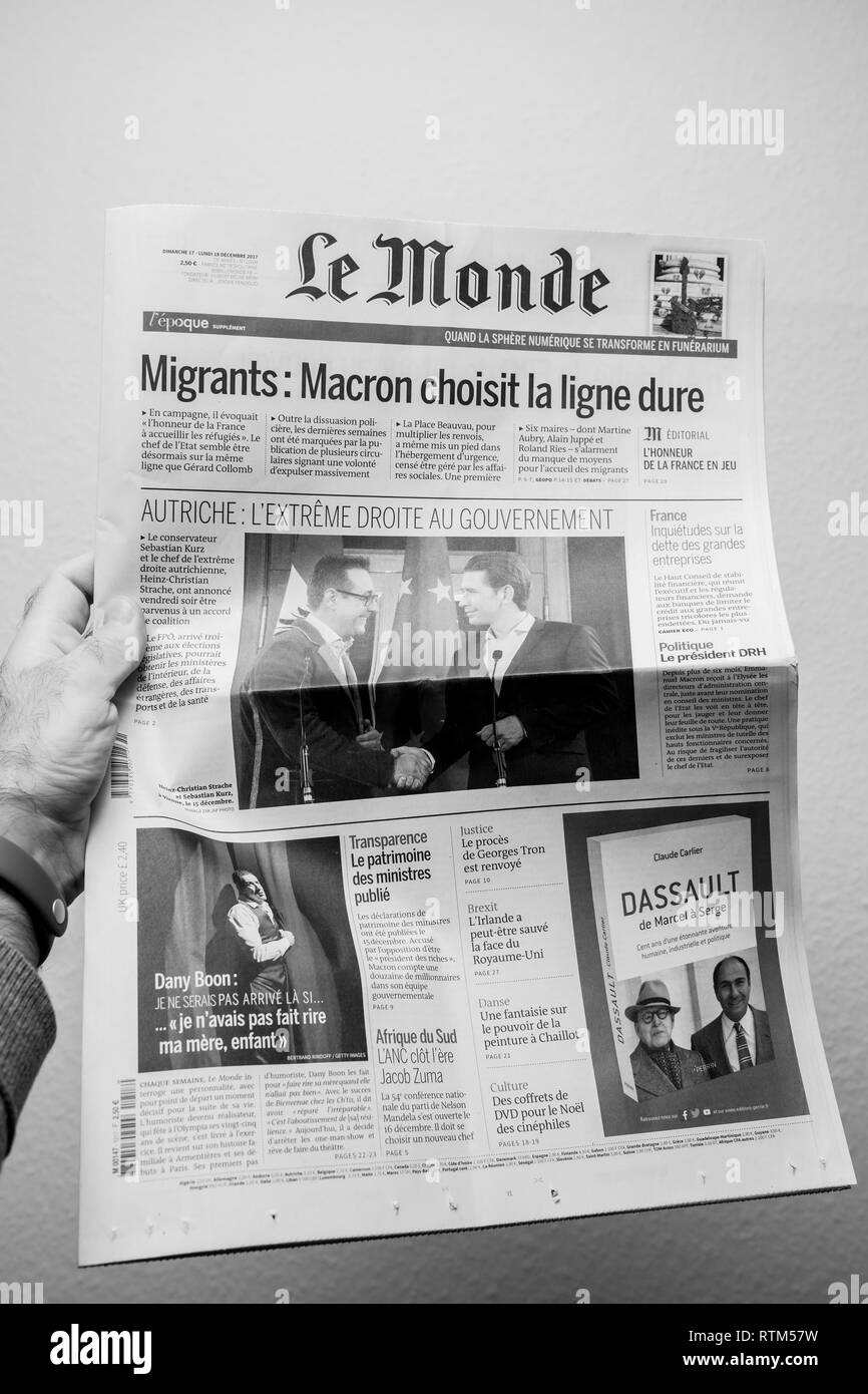 PARIS, FRANCE - DEC 18, 2017: Man reading Le Monde French cover ...
