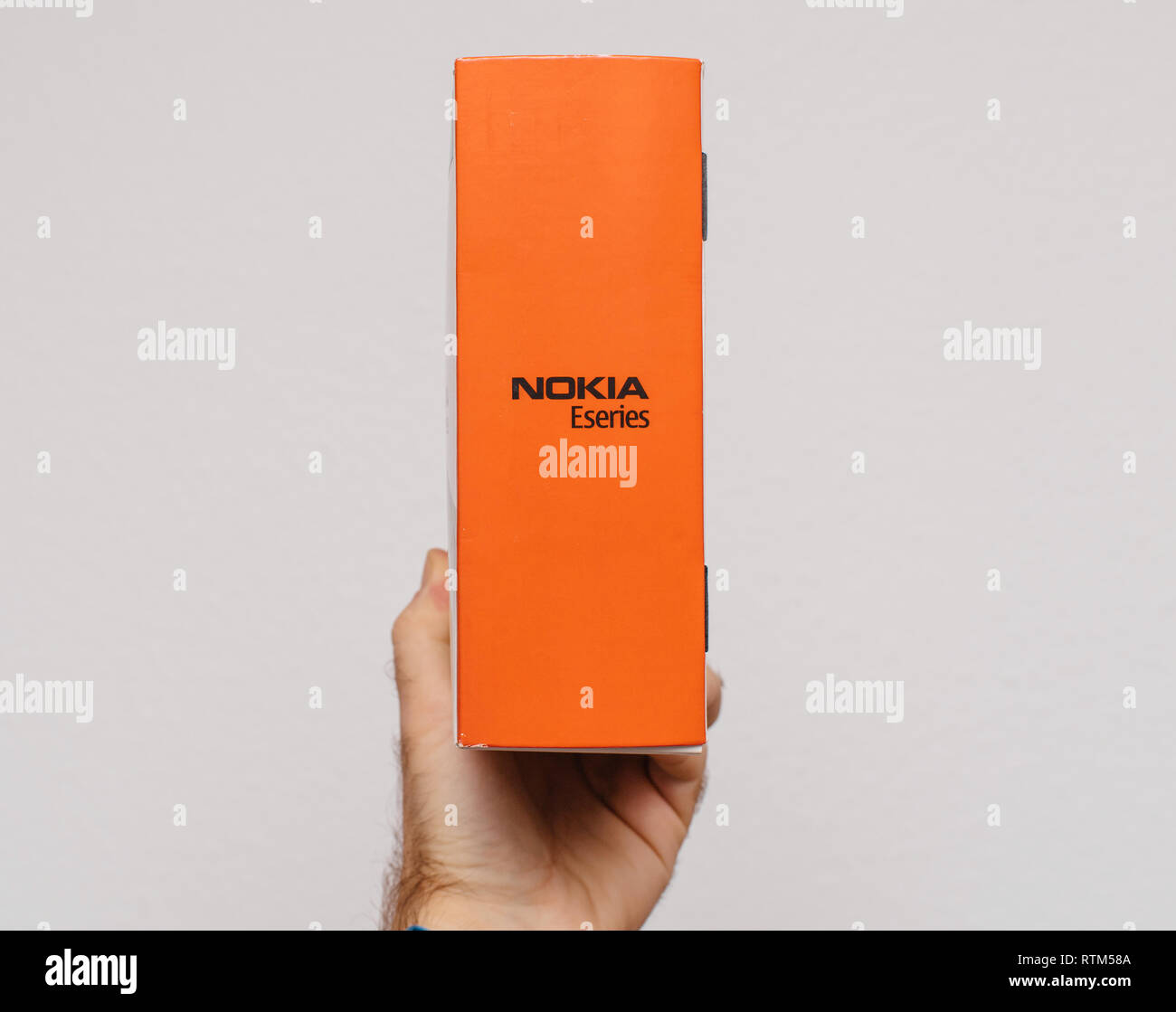 PARIS, FRANCE - DEC 18, 2017: Man holding against white background ...