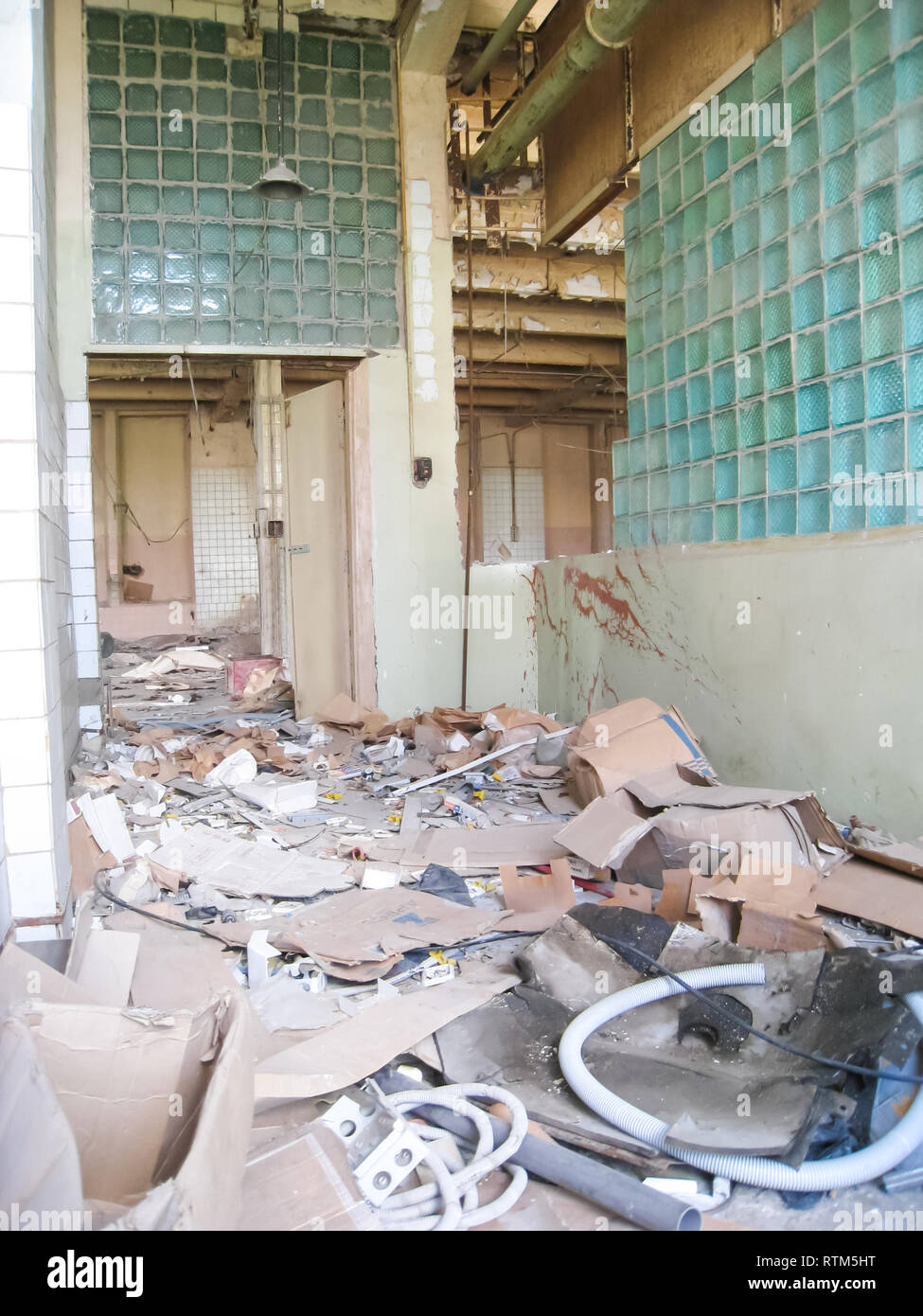 Garbage and old furniture in an abandoned building Stock Photo - Alamy