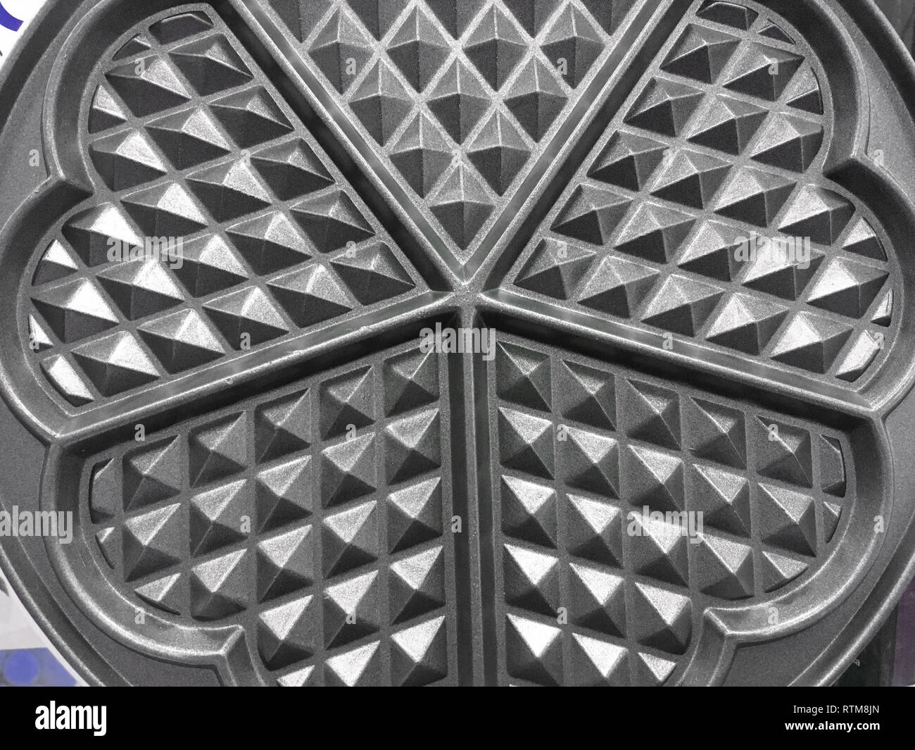 A close up shot of a silver waffle iron texture Stock Photo - Alamy