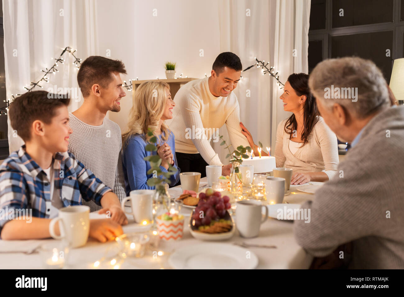 happy family having birthday party at home Stock Photo - Alamy