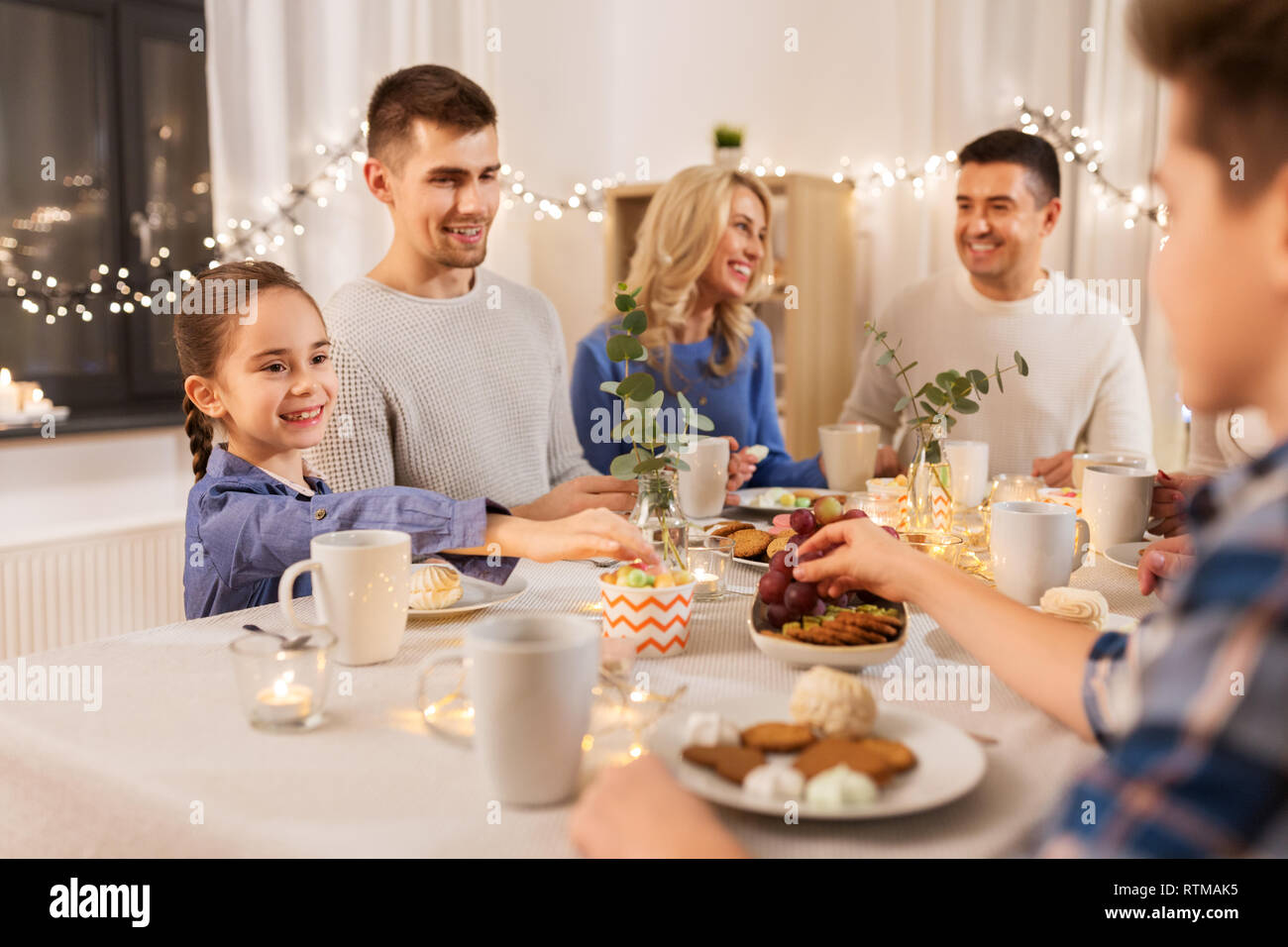 happy family having tea party at home Stock Photo - Alamy